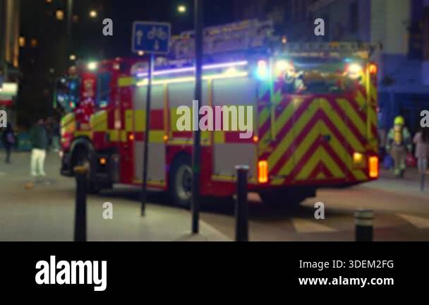 Fire truck responding to emergency accident at night with flashing ...