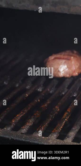 Steakhouse. Steaks are roasted on a Josper oven. Frying a steak on a ...
