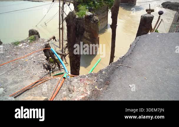 Road collapse near bridge after heavy flood in Dehradun India. High ...