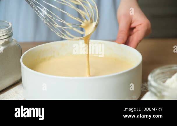 Texture of batter for baking, dough dripping from whisk close-up Stock ...