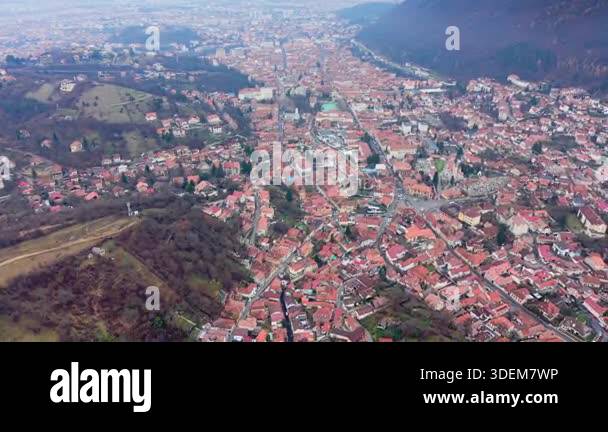 Aerial drone footage showing the city of Brasov in Transylvania ...