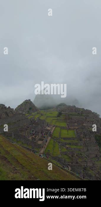 A panoramic view of the Machu Picchu archaeological site partially ...