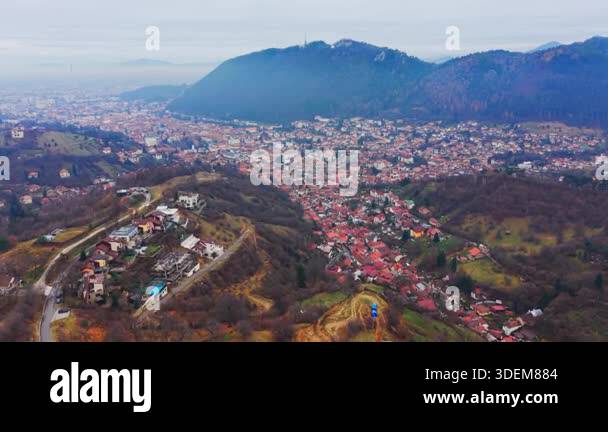 Aerial drone footage of Brasov old town with Tampa Peak and the Brasov ...