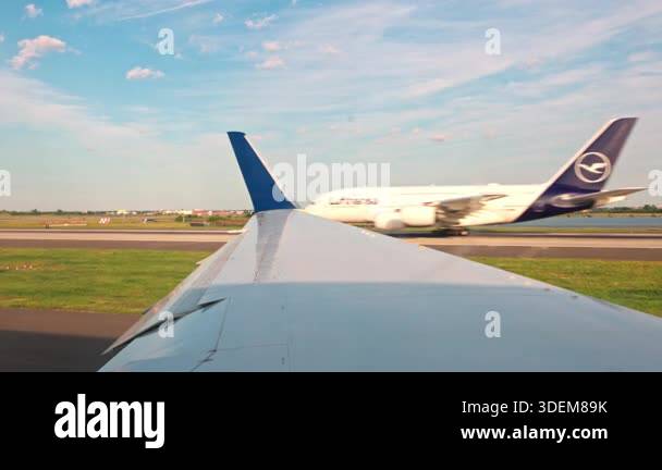 Beautiful view from airplane window of runway with Lufthansa aircraft ...