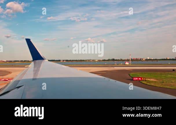 Beautiful view of airplane wing on airport runway during taxi with ...