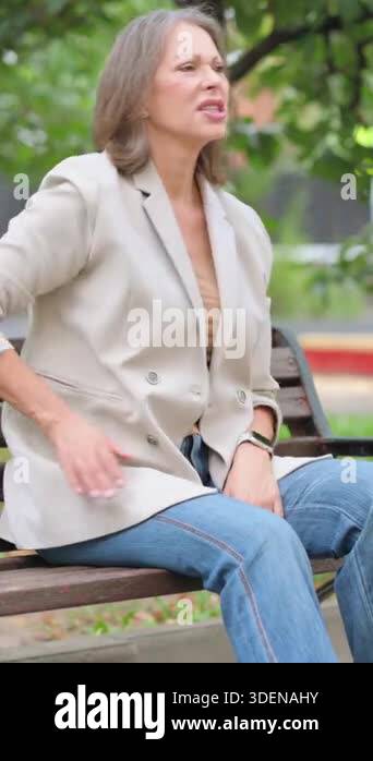 Old Woman Coughing while Sitting Outdoor on Bench Stock Video Footage ...