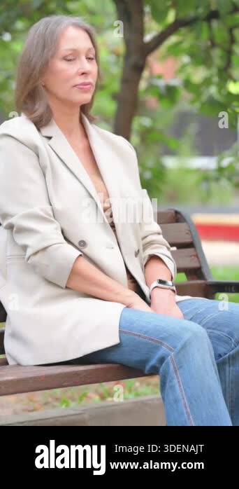 Shocked Old Woman Looking at Camera while Sitting on Bench Outdoor ...