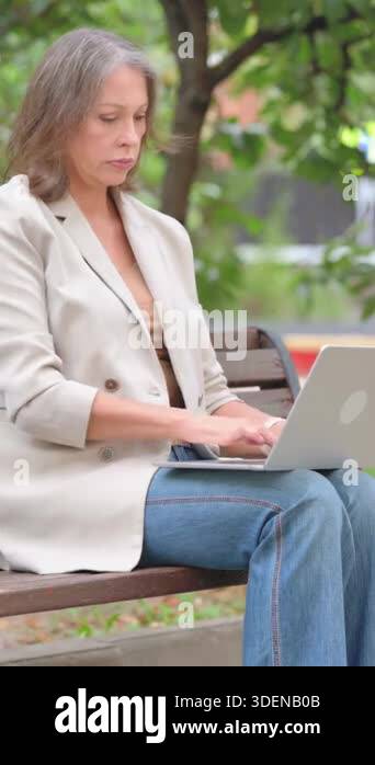 Old Woman Closing Laptop and Leaving Outdoor Bench Stock Video Footage ...
