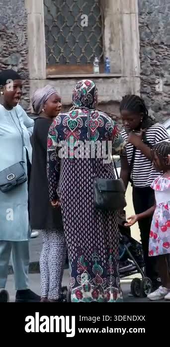 Real life street scene in Catania Sicily Italy with African women ...