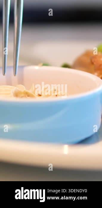 Fork, appetizer, plate cream cheese Cut the buffalo mozzarella with a ...