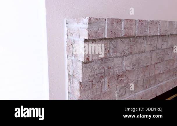 Detailed side view of a fireplace corner showing horizontal brick ...