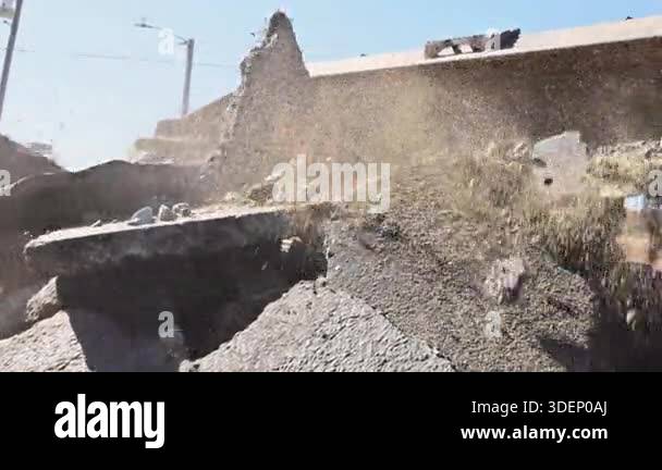 Excavator machine with large bucket pours waste dirt into container at ...