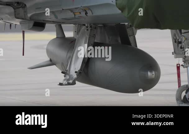 Pair of external fuel tanks mounted under wing on military transport ...