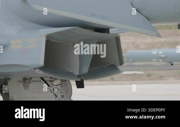 Detailed close-up of military aircraft underfuselage engine intake ...