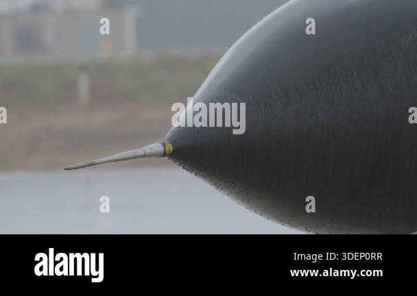 Close up view of military jet nose radome and sensor probe with rain ...