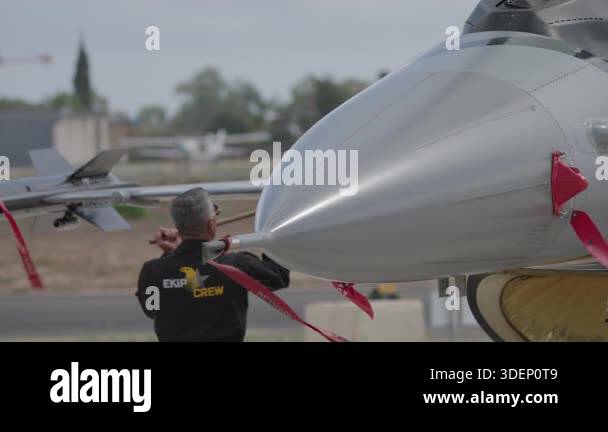 Crew member removing protective cover from pitot static probe on ...
