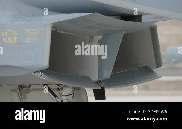 Detailed view of fighter aircraft underfuselage engine air intake ...