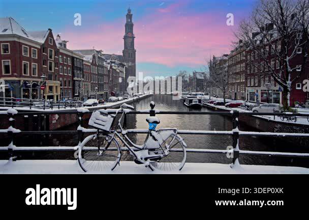 Snowy Amsterdam in winter with the Wester church in the Netherlands ...