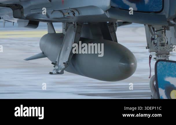 External fuel tank mounted under fighter jet fuselage to extend flight ...
