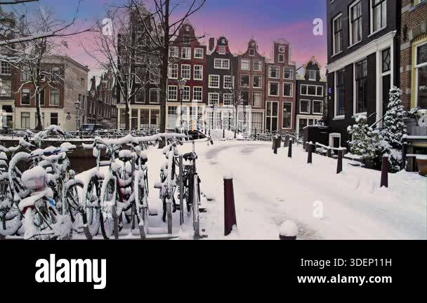 Snowy Amsterdam in winter in the Netherlands at sunset. High quality 4k ...