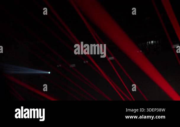 Dynamic laser and strobe lighting fills concert space creating intense ...