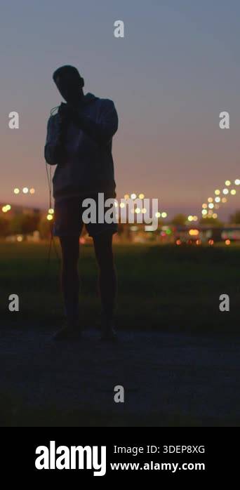 Runner exercising outdoors, Evening jump rope silhouette scene, Dusk ...