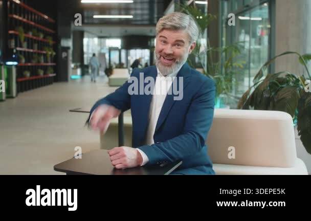 I choose you. Caucasian middle-aged businessman pointing to camera ...