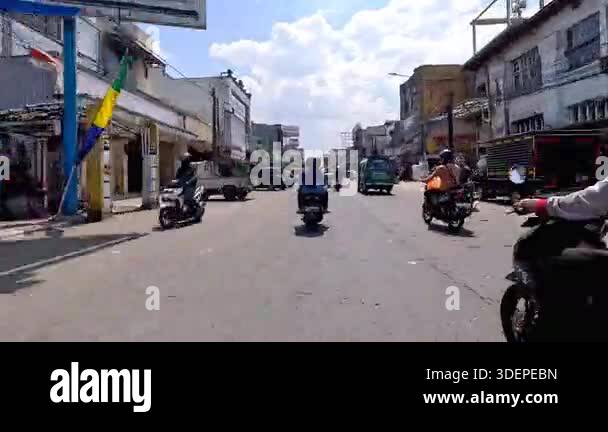 4K cinematic footage capturing the bustling streets of Bandung, showing ...