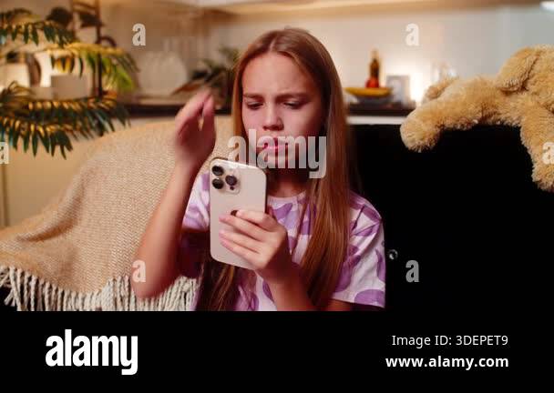 Teenager girl sees defeat alert on smartphone at night home feels ...