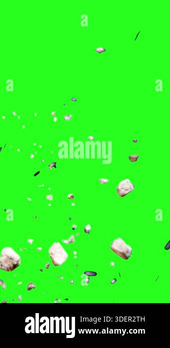 Debris and stones flying in the air on green screen background Stock ...