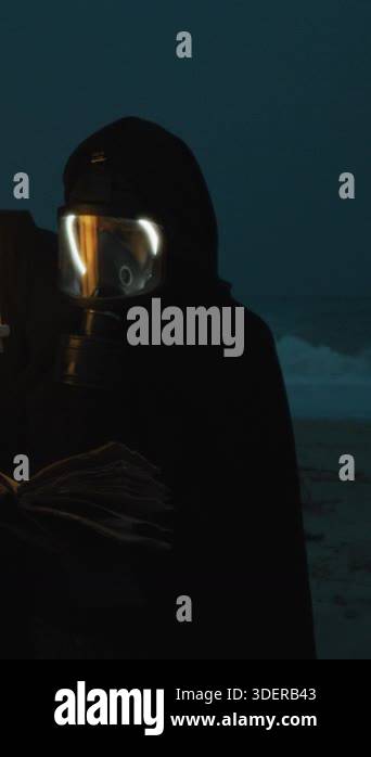 Man With Gas Mask Reads Mysterious Book Near Stormy Ocean At Night ...