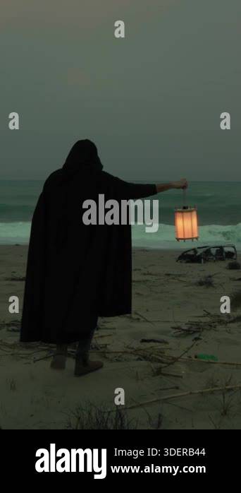 Silhouette Of A Man Walking Towards The Stormy Ocean The Night Of ...