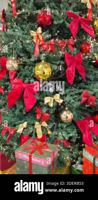 A close-up of a beautifully decorated Christmas tree. The tree is ...