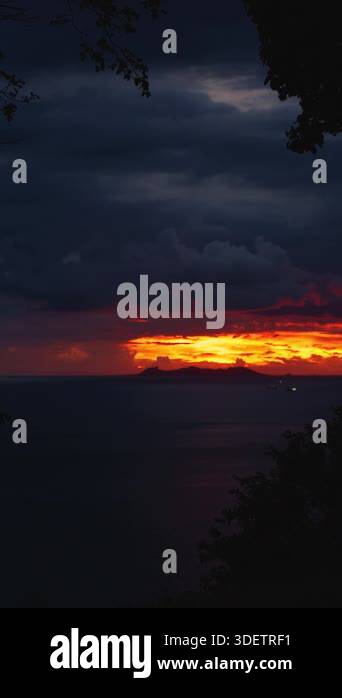 Vertical video. Woman Walks Toward the Edge of a Cliff Surrounded by ...