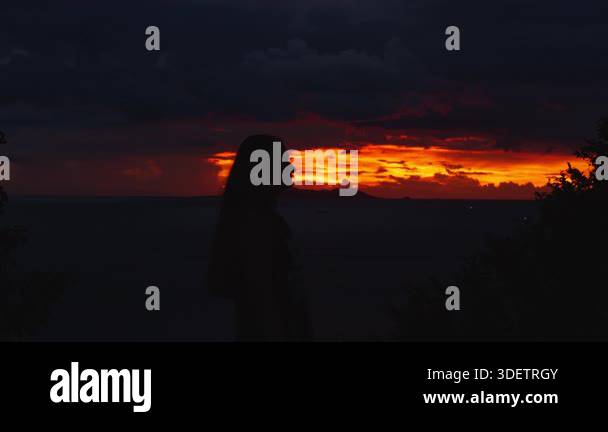 Man Kisses Woman in Tender Silhouette as They Stand Facing Each Other ...