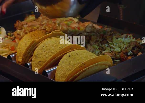 Fresh Hard-Shell Tacos Filled with Chicken, Cabbage, and Vegetables on ...