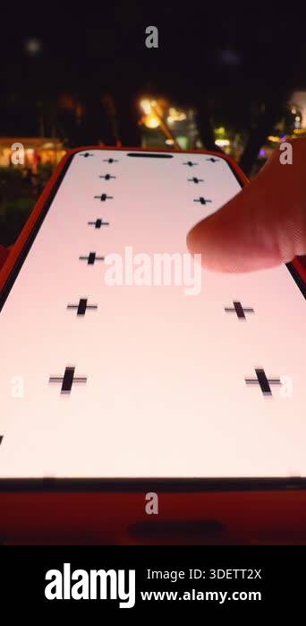 Vertical video. Man Holding Smartphone with Tracking Markers on Screen ...