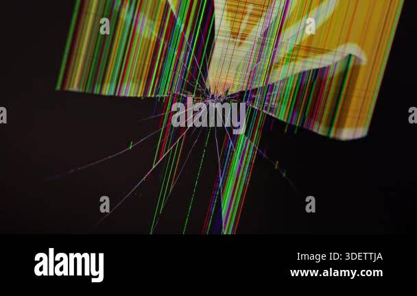 Abstract detail of a broken device screen with shattered glass and ...