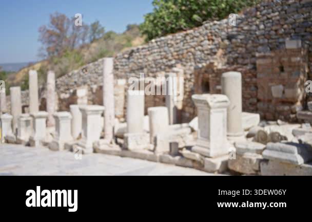 Ephesus ancient ruins defocused marble columns and weathered stone wall ...
