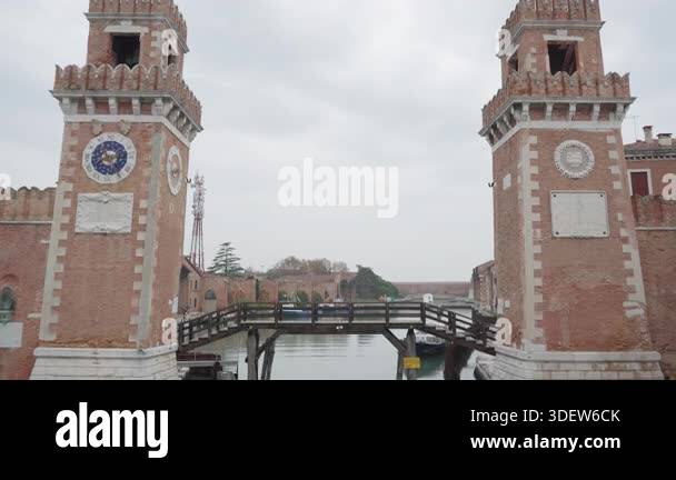 Venetian Arsenal entrance towers with wooden bridge over canal ...