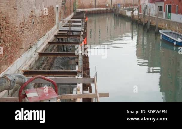 Construction work for canal restoration in Venice Italy. Waterway ...