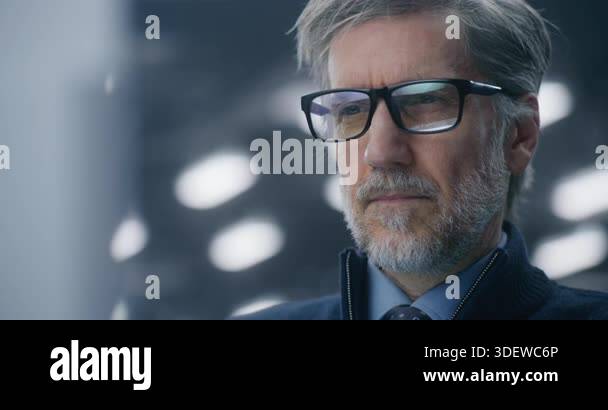 Close Up of Focused, Bespectacled Male Data Analyst Intently Checking ...
