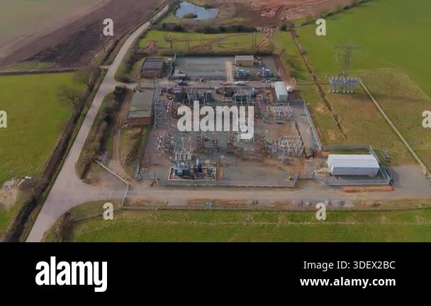 Aerial drone view of electrical sub station and powerlines ...