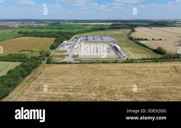 Aerial drone shot of electrical sub station, powerlines, pylons and ...