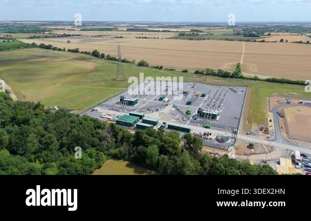 Aerial drone shot of electrical sub station, powerlines, pylons and ...