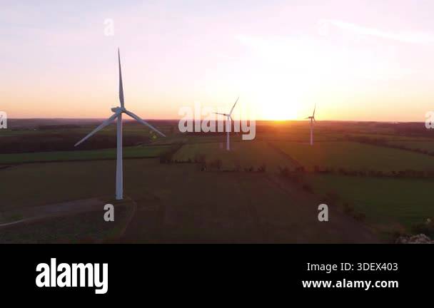 Aerial view of wind turbines at sunset. Golden light and rural ...