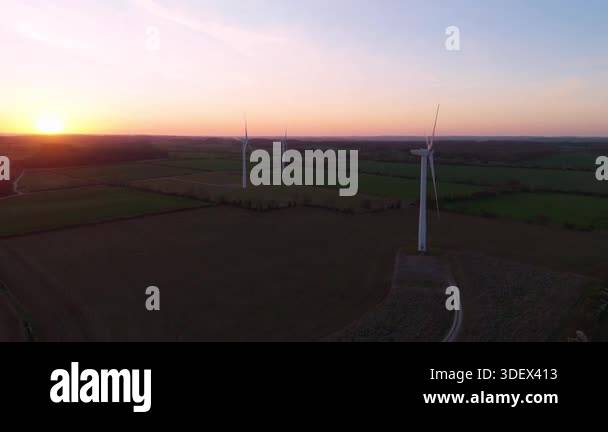 Aerial view of wind turbines at sunset. Golden light and rural ...