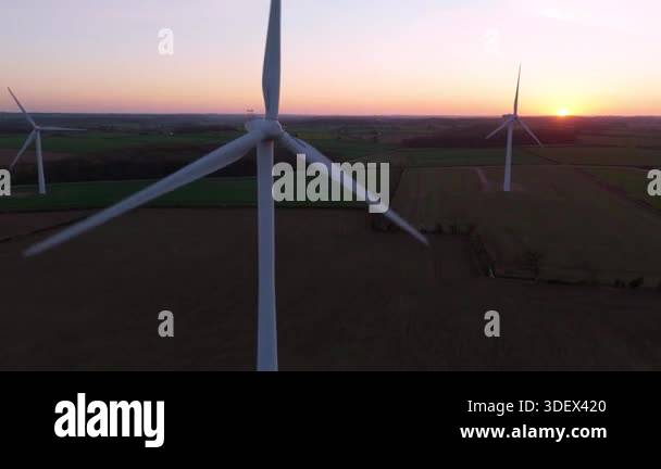 Aerial view of wind turbines at sunset. Golden light and rural ...