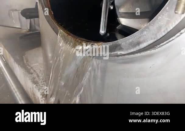 Dirty Water Spills From Stainless Steel Tank Hatch in Industrial ...