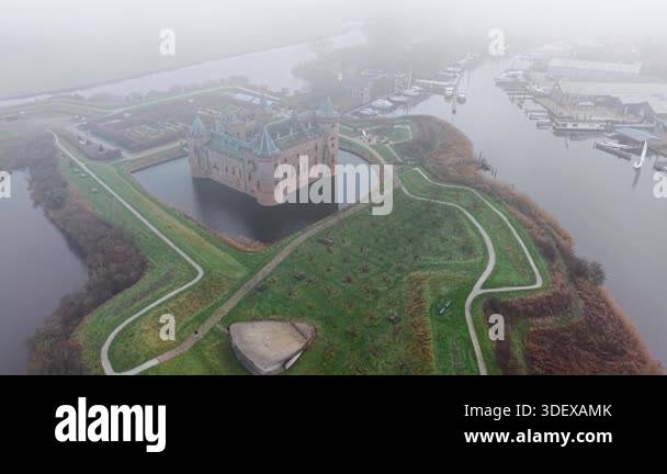 Aerial view of Muiderslot Castle moated medieval fortress with conical ...